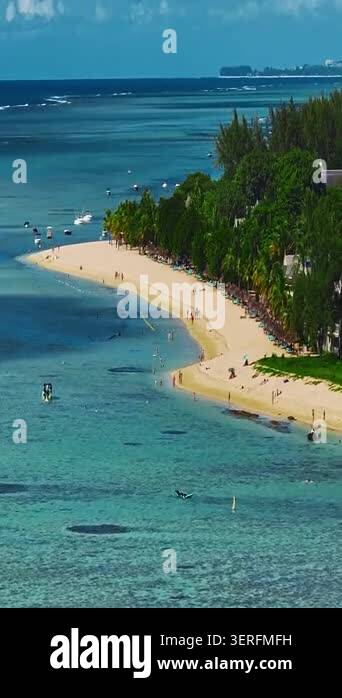 Aerial view of boats and catamarans with tourists and a passing ...