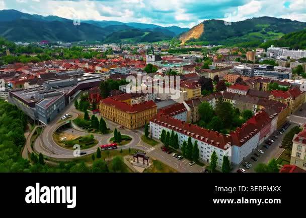 Aerial view of beautiful industrial town of Leoben in the mountains in ...