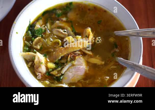 A warm and delicious bowl of traditional Indonesian chicken soup (Soto ...