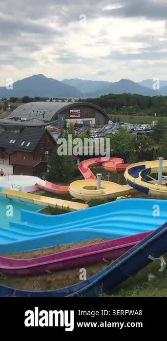 Mountain aquapark in Slovakia with colorful water slides, outdoor pools ...
