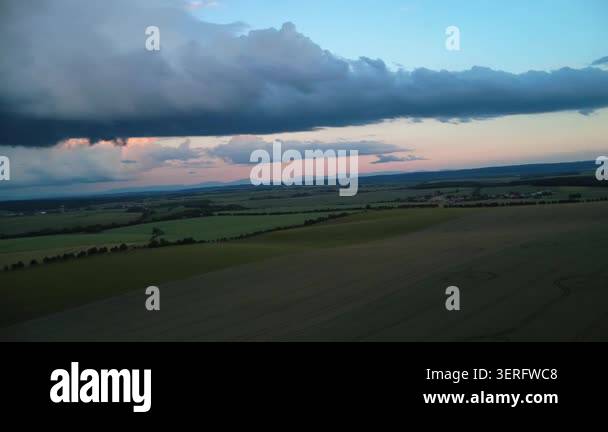 Aerial drone view of massive storm clouds moving across the landscape ...