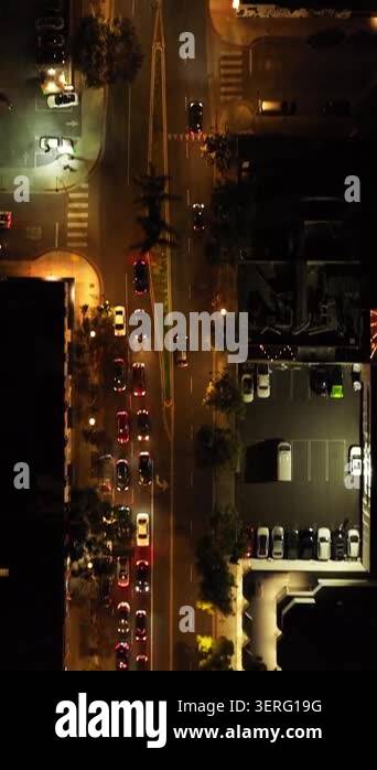 Top down view of traffic in streets in night city. Vehicles driving on ...