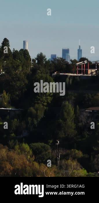 Aerial ascending footage of houses in lucrative location in hills above ...
