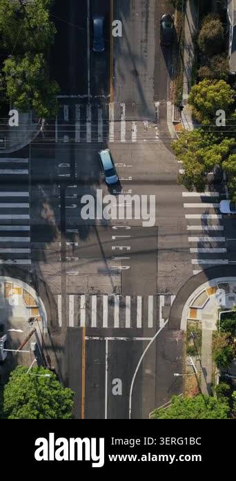 Cars driving on city road in Los Angeles with traffic at crossroads and ...
