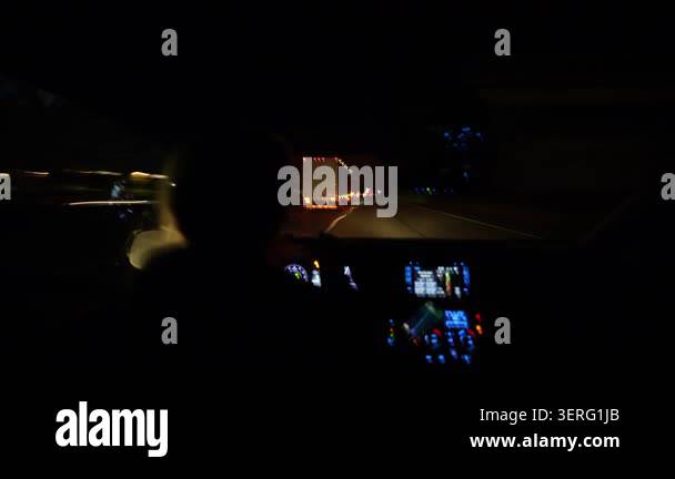Night driving with dynamic vehicle motion. Night driving on illuminated ...