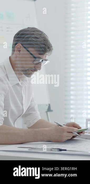Architect brainstorming innovative construction concepts, tapping a ...