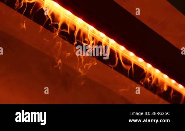 Artificial diagonal fire line with steam in dark atmosphere. High ...