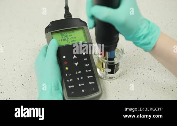 Close up laboratory footage of water analysis using a multifunction pH ...