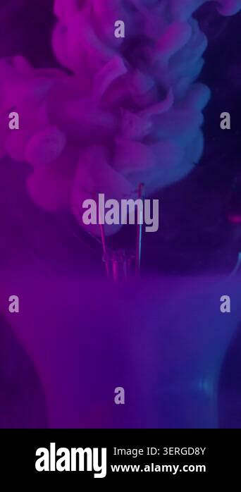 Vertical video. Swirling fog fluid. Paint background. Defocused purple ...