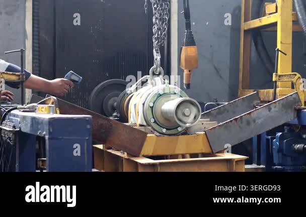 An industrial testing rig testing a rotating mechanical shaft component ...