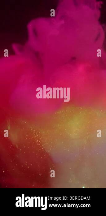 Vertical video. Paint drop. Swirling mist. Defocused pink white orange ...