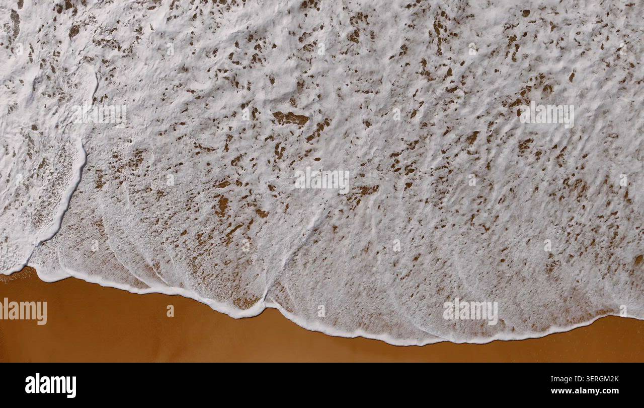 Aerial View Of Ocean Waves Crashing Onto Sandy Beach Stock Video ...