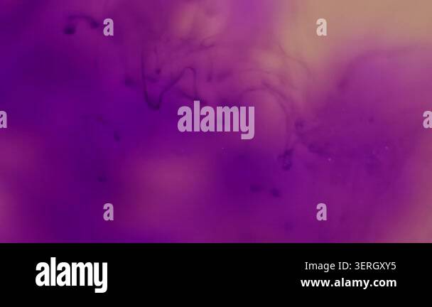 Ink cloud. Color water. Defocused purple yellow liquid splash fume ...