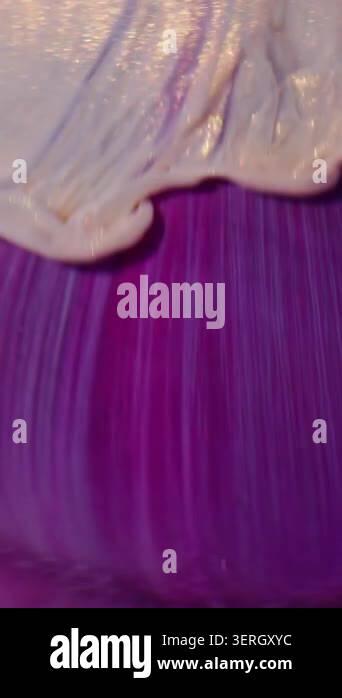 Vertical video. Paint leak. Blur sparkling flow. Colorful neon acrylic ...