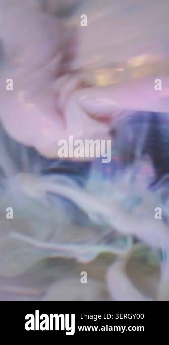 Vertical video. Dye spill. Blur paint wave. Sparkling white smoke ...