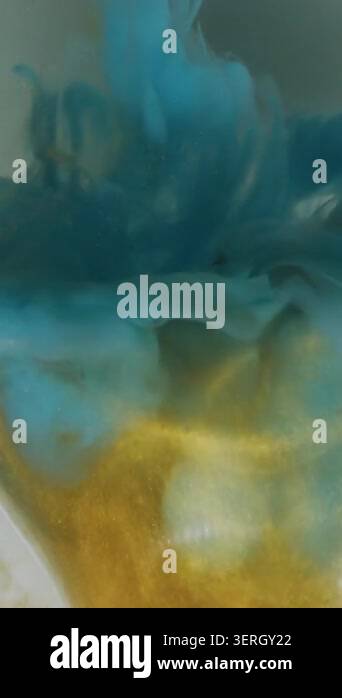 Vertical video. Color smoke cloud. Cracked light bulb. Defocused blue ...