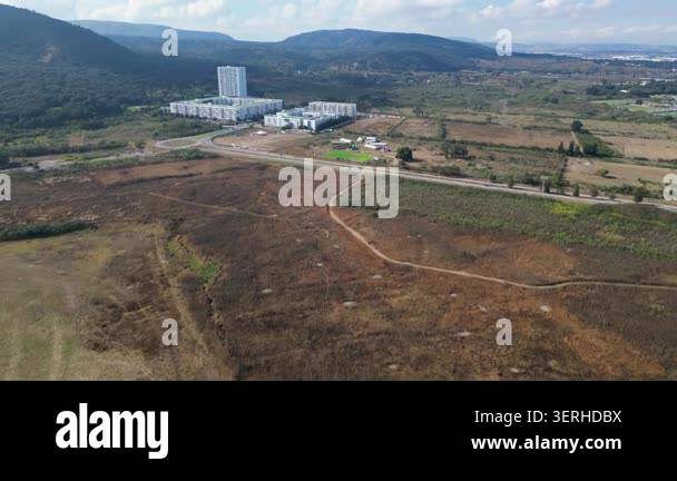 Panoramic aerial video of a modern residential complex surrounded by ...