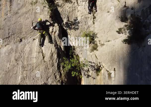 people climbing up the cliff Stock Video Footage - Alamy
