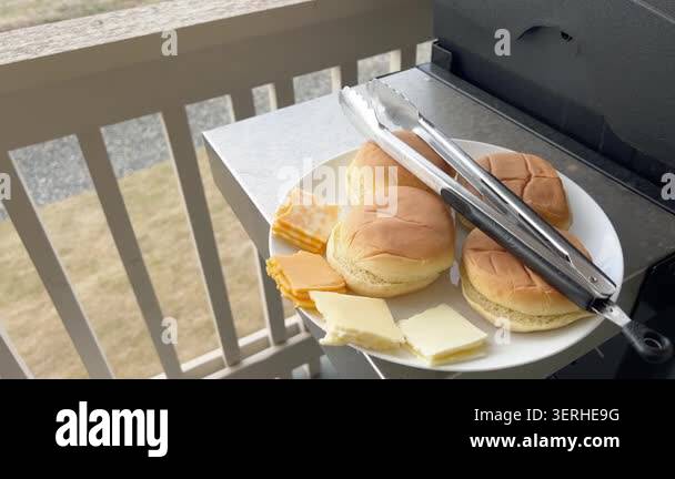 Castle Rock, CO, USA-236 - April 22, 2025 - A white plate with burger ...