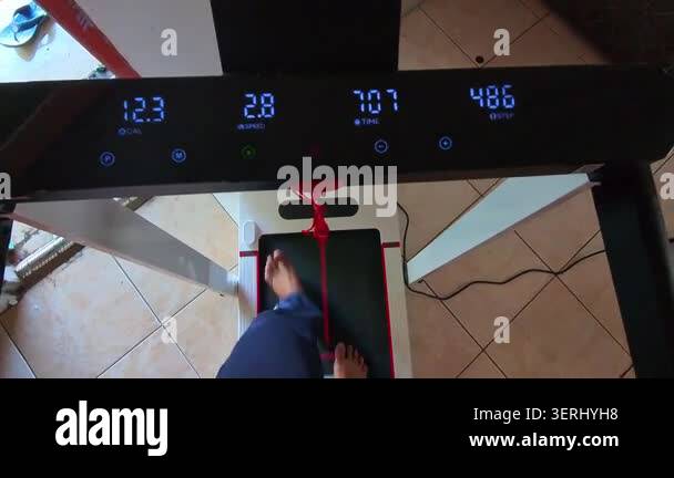 Top Angle Video of Person walks on treadmill, monitoring time and steps ...