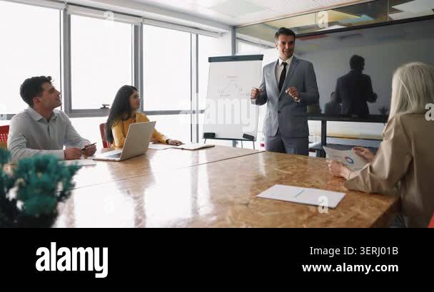 Confident business leader man in formal suit holding presentation with ...