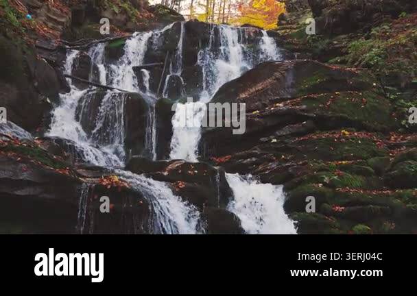 Slow-motion 4K zoom video waterfall stream falling down rocks and ...