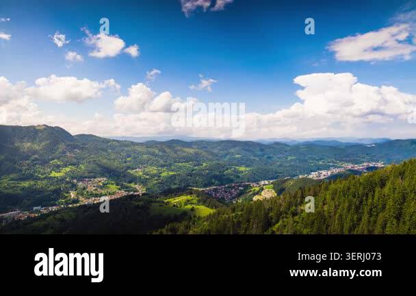 View from high rock to old village Smolyan with green meadows for ...