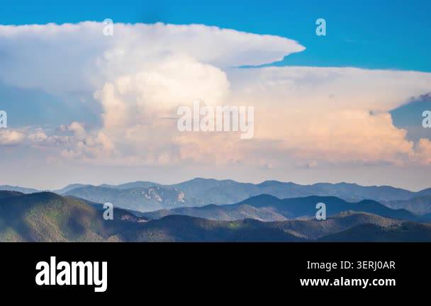 Huge dense dangerous clouds scatter across the sky from a big explosion ...