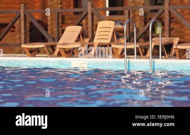 Top view of a large deep pool with clear transparent cool water with ...