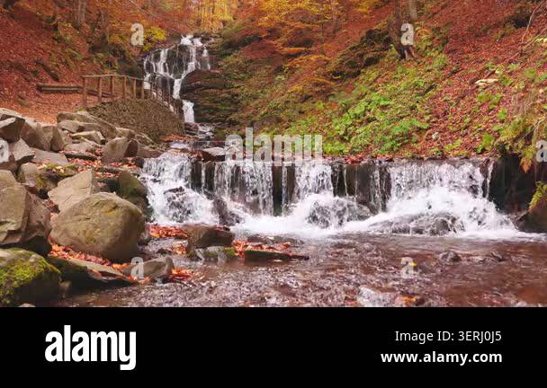 Beautiful Waterfall Shipot in the autumn forest of the Carpathian ...
