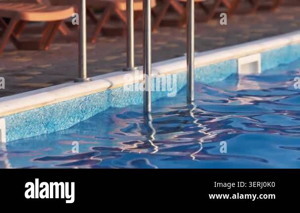 Top view of a large deep pool with clear transparent cool water with ...