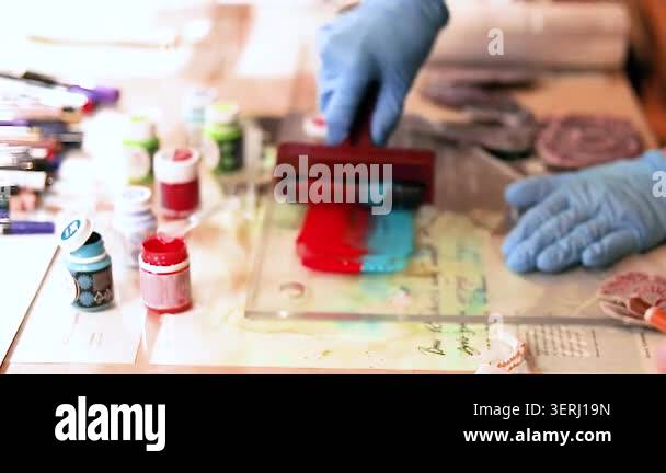 Roll blue and red colors onto hand-printed blanks with a roller ...