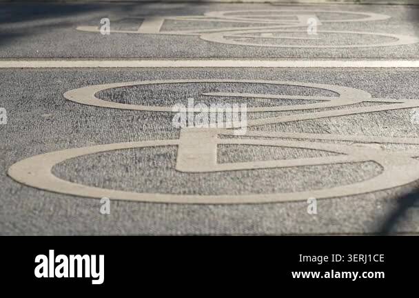 Close Up of a Bicycle Road. Blue Bike Lane With the Bicycles passing on ...