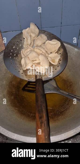 Vertical overhead close up of freshly fried Indonesian white crackers ...