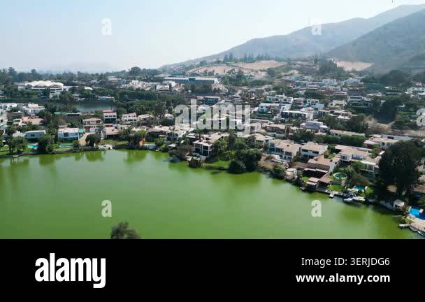 Aerial panning shot over the wealthy residential neighborhood of La ...