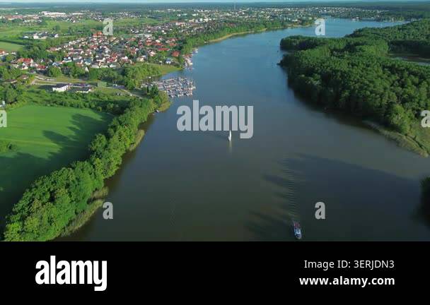 Aerial View of Waterfront Landscape with Trees, Fields and Buildings on ...
