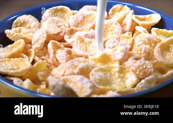 cornflakes in a white plate Stock Video Footage - Alamy