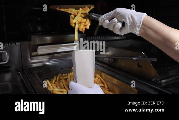 chef preparing a delicious fries Stock Video Footage - Alamy