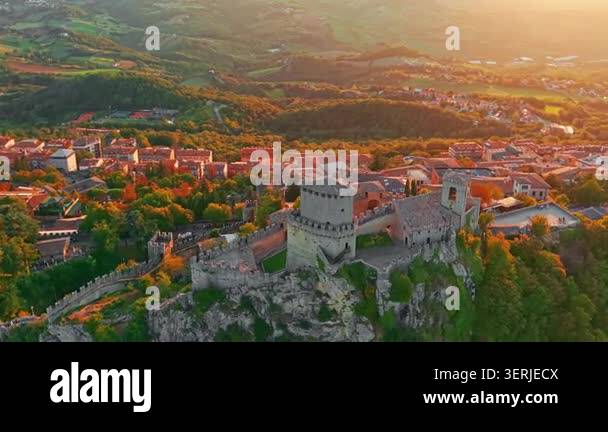 Aerial drone view of San Marino old town featuring the majestic Three ...
