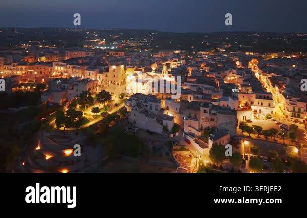 Aerial view of Cisternino town at night, Puglia, Italy. The white ...