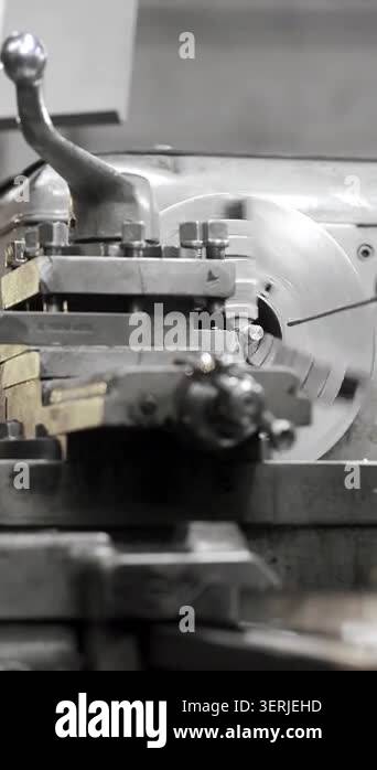 Close up of metal turning operation on industrial lathe machine ...