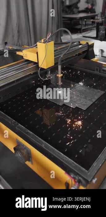 Automated CNC plasma cutting machine cutting steel sheet with bright ...