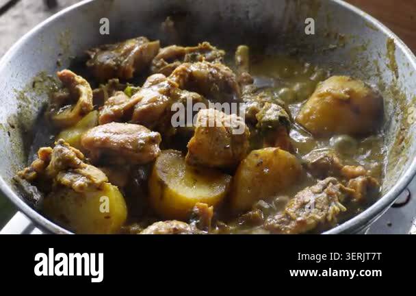 Chicken Curry with Potatoes in Rich Spicy Gravy Stock Video Footage - Alamy