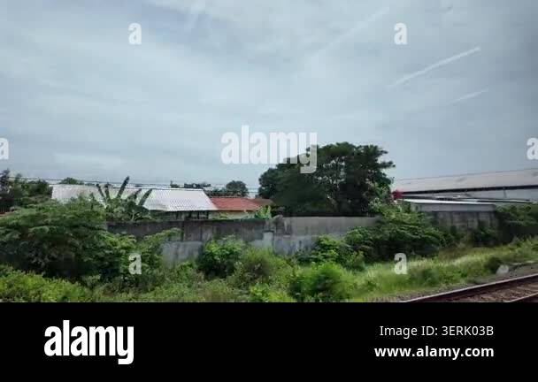Train ride through landscapes on Java Island Stock Video Footage - Alamy