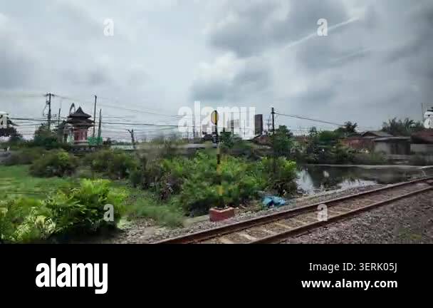 Train ride through landscapes on Java Island Stock Video Footage - Alamy