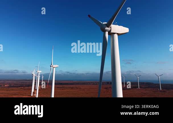 Wind turbines on arid plateau near Black Sea coast, Bulgaria. Low angle ...