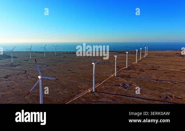 Row of wind turbines along cliff edge facing the Black Sea, Bulgaria ...