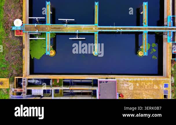 Overhead view of aeration basin with blue framework at sewage plant ...