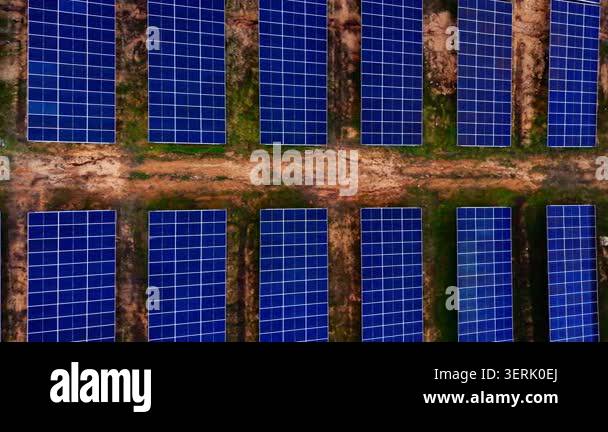 Parallel solar panel rows across flat field, Bulgaria. Near-overhead ...