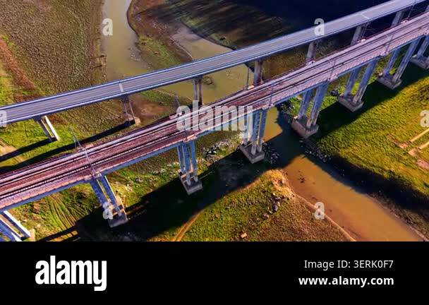 Aerial view of parallel road and railway bridges. Elevated perspective ...